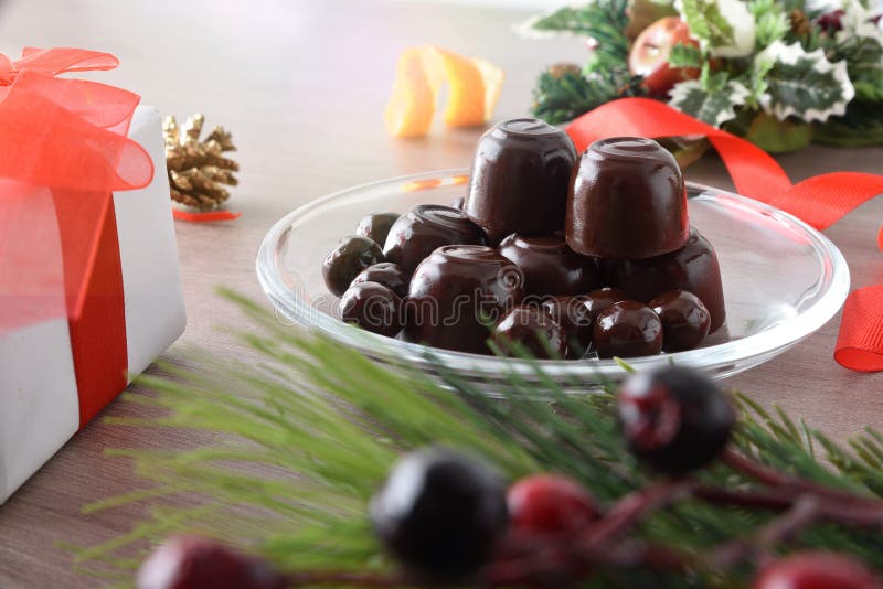 Chocolate Candies Detail on Table with Christmas Decorations Elevated ...