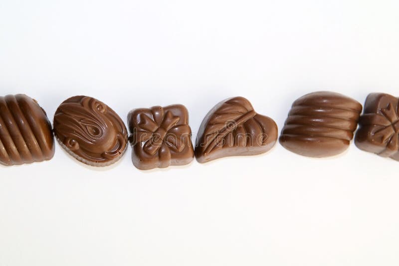 Chocolate candies in line stock photo. Image of ball, line - 5101032