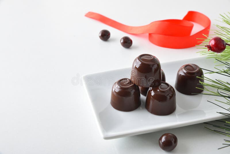 Chocolate Candies on Plate on White and Red Bow Stock Photo - Image of ...