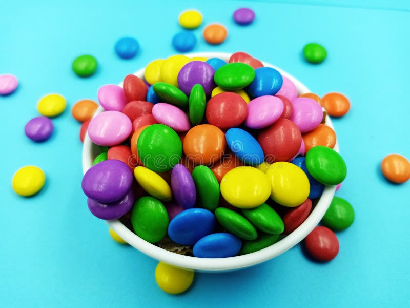Chocolate Candy Gems on Blue Stock Image - Image of freshness, dessert ...