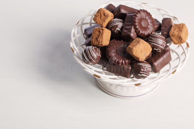 Chocolate Candy on Plate on White Table Stock Photo - Image of ...