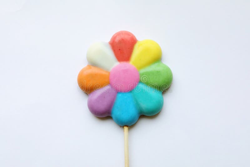 Chocolate candy on a stick stock photo. Image of flower - 241980416