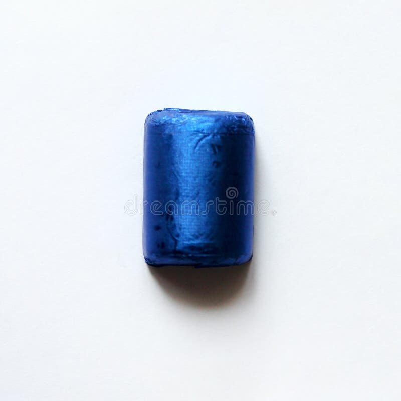 Chocolate Candy Wrapped in Blue Foil Isolated on White Surface Stock ...