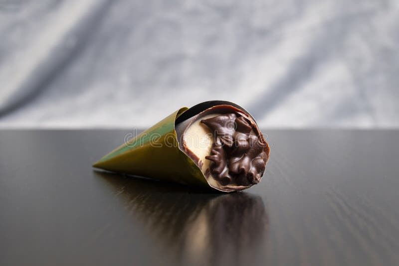 Chocolate Candy in a Yellow Wrapper on Wooden Table Stock Photo - Image ...