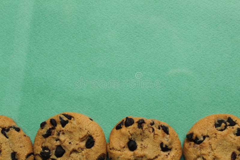 Chocolate Chip Cookie Food Background on Green Background with Space ...