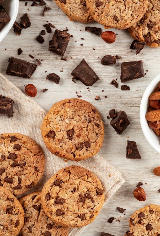 Chocolate Chip Cookies with Nuts and Chocolate Pieces on Wooden Table ...