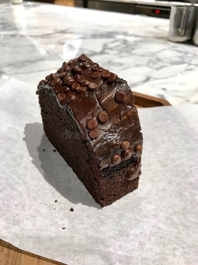 Chocolate Chip Sponge Cake Slice with Coffee on Marble Surface Stock ...