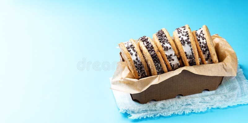 Chocolate Chip Vanilla Ice Cream Cookie Sandwiches on Blue Background ...