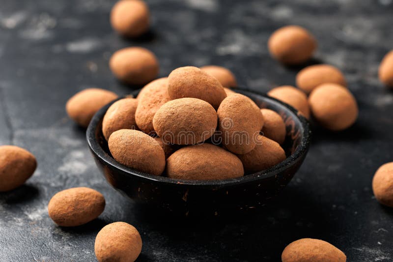 Chocolate Coated Almonds in Bowl. Cocoa Coated Almonds Stock Photo ...
