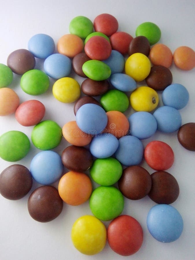 Chocolate Colorido Com Fundo Branco Imagem de Stock - Imagem de ...