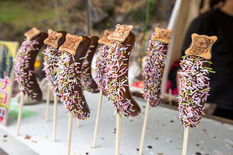 Chocolate covered bananas stock photo. Image of market - 71560184
