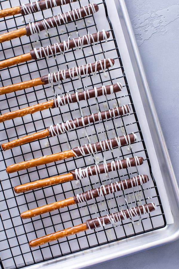 Chocolate Covered Pretzel Rods Freshly Made on a Cooling Rack Stock ...