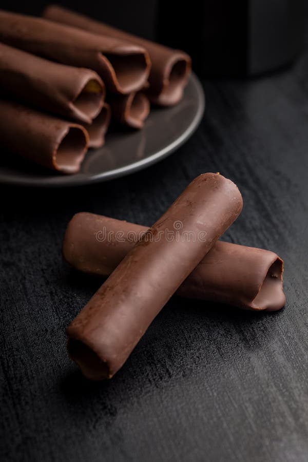 Chocolate Covered Wafers on a Dark Tabletop Stock Photo - Image of ...