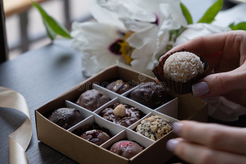 Chocolate Craft Candy in Female Hand and Candy Box Stock Photo - Image ...