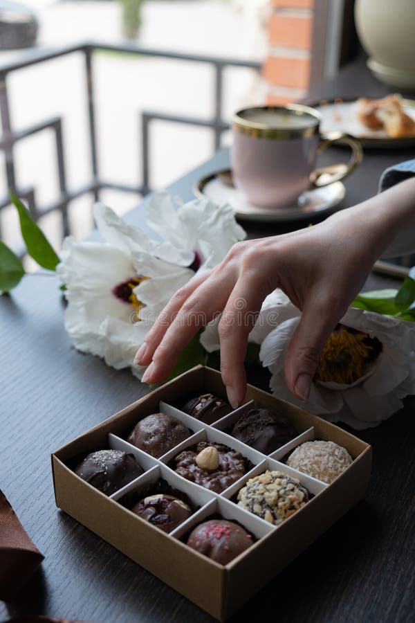 Chocolate Craft Candy in Female Hand and Candy Box Stock Image - Image ...
