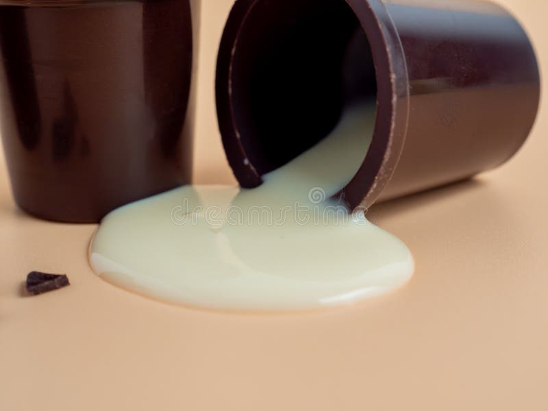 Chocolate Cup Filled with White Pudding on an Orange Background ...