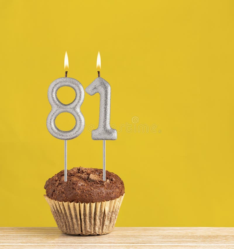 Chocolate Cupcake with Number 81 Candle - Birthday on a Yellow ...