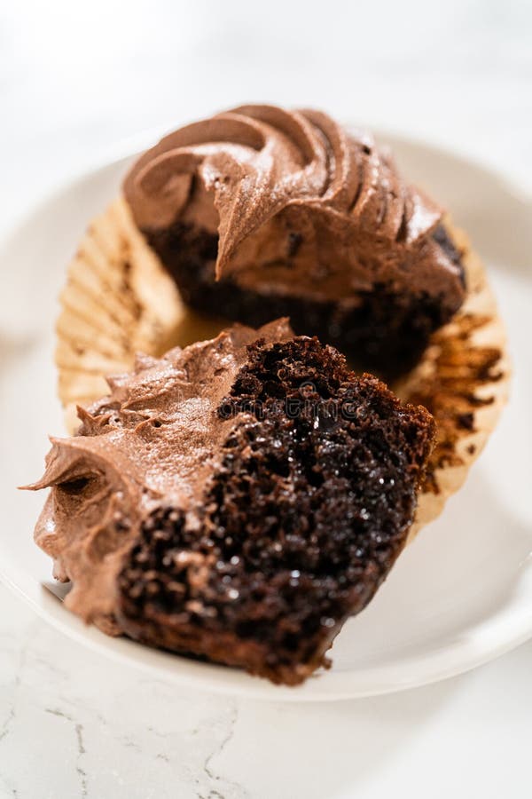 Chocolate Cupcake Sliced in Half on Kitchen Counter Stock Image - Image ...
