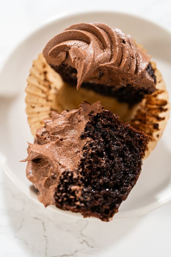 Chocolate Cupcake Sliced in Half on Kitchen Counter Stock Photo - Image ...
