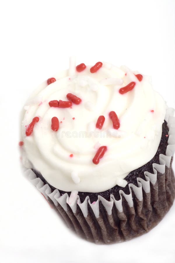A Chocolate Cupcake with White Frosting and Red White Sprinkles Stock ...