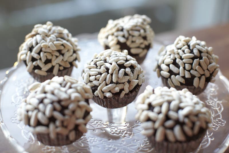 Chocolate Cupcakes with White Icing and Gold Sprinkles Stock Photo ...
