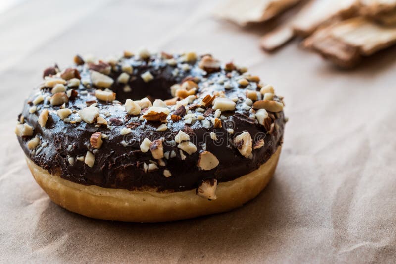Chocolate Donut with Diced Hazelnut Pieces. Stock Photo - Image of ...