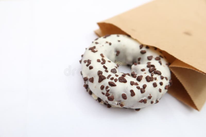 Chocolate Donuts in a Paper Packet on White Stock Image - Image of ...