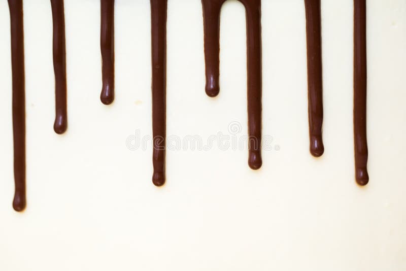 Chocolate Drips on the Background of White Cream. Stock Photo - Image ...