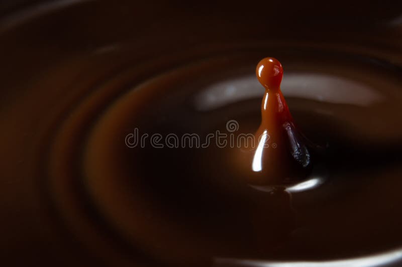 Chocolate Drop Falls on a Chocolate Background Stock Image - Image of ...