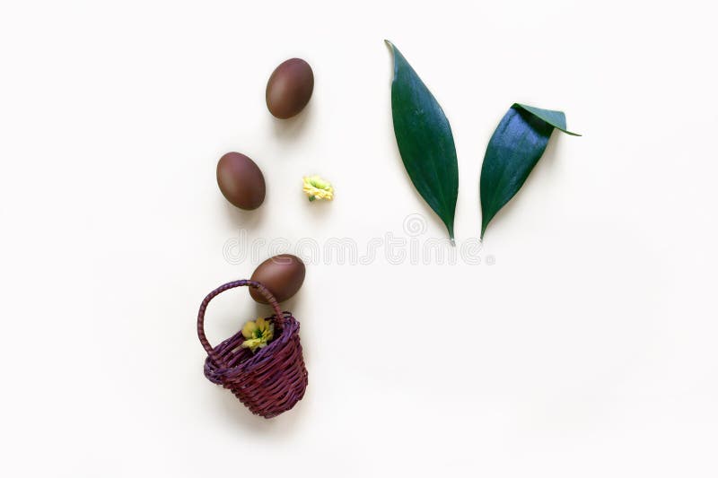 Chocolate Easter Eggs in Basket with Bunny Ears Stock Image - Image of ...