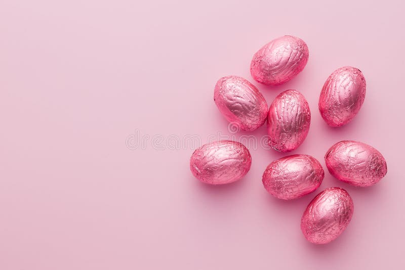Chocolate Easter Eggs Wrapped in Pink Colored Foil on Pink Background ...