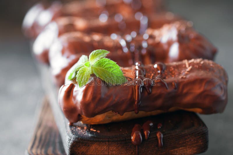 Chocolate Eclair Decorated with Mint and Melted Chocolate Stock Image ...