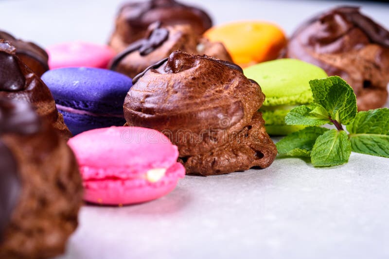 Chocolate Eclairs and Macaroons for the Restaurant Menu1 Stock Photo ...