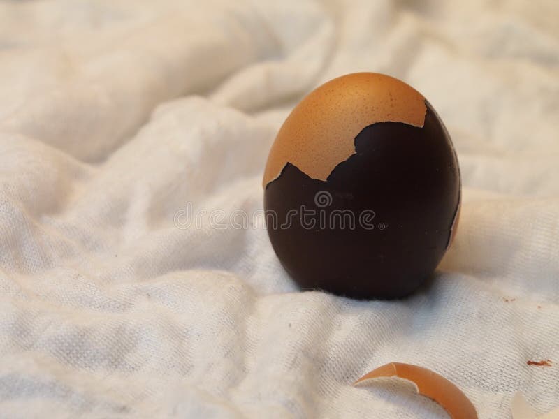 Chocolate Egg, Partial Egg Shell, White Cloth Stock Photo - Image of ...