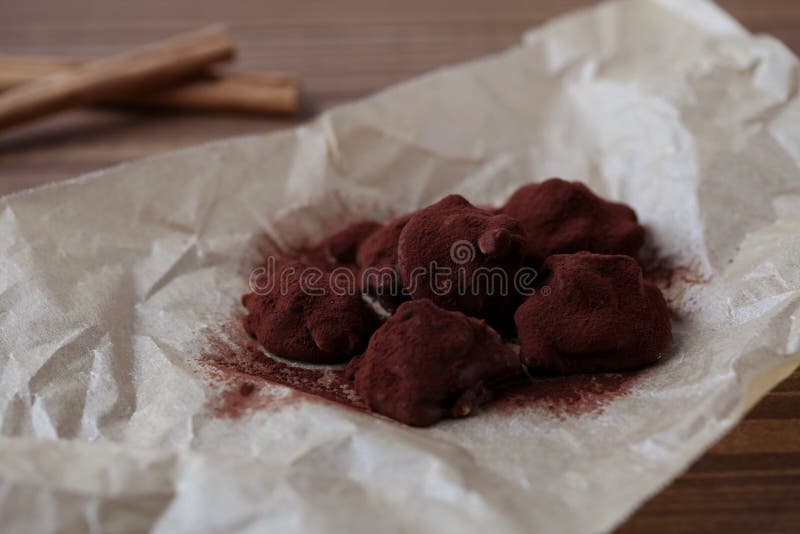 Chocolate Ganache Crunch on Wooden Table Stock Image - Image of covered ...