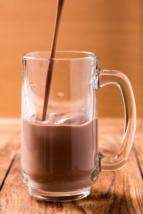 Chocolate in Glass Pouring from Top on Wood Table Stock Photo - Image ...