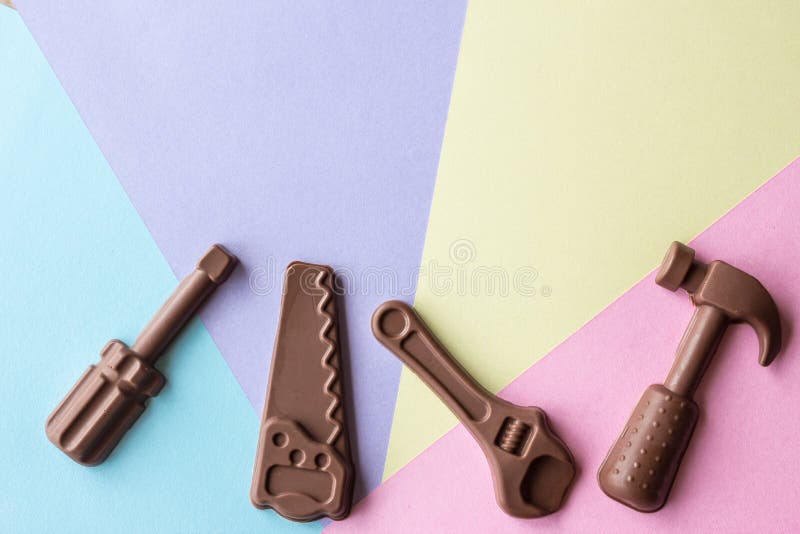 Chocolate Hand Tools on a Colourful Background Stock Photo - Image of ...
