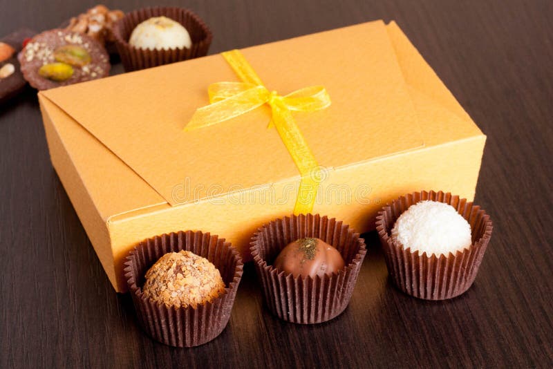 Chocolate Handmade Candies on a Black Table. Chocolate Box Stock Image ...