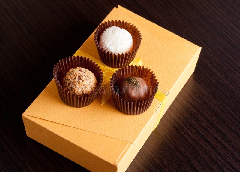 Chocolate Handmade Candies on a Black Table. Chocolate Box Stock Photo ...
