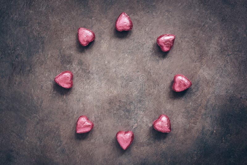 Heart of the Round Chocolate Candies on a Wooden Board Stock Photo ...