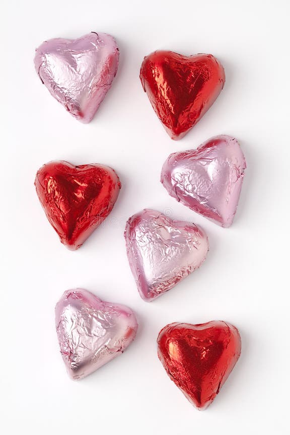 Chocolate Hearts in Pink and Red Tinfoil Stock Photo - Image of gift ...