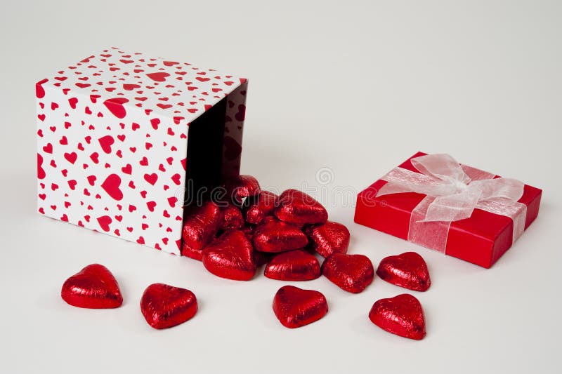 Chocolate Hearts Spilling Out of a Heart Gift Box Stock Photo - Image ...