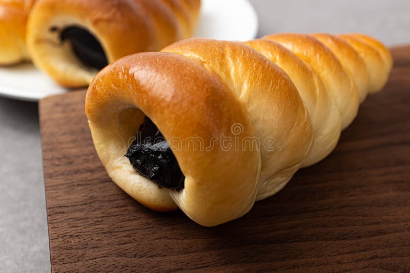 Chocolate Horn Bread in the Shape of a Cone Filled with Chocolate Stock ...