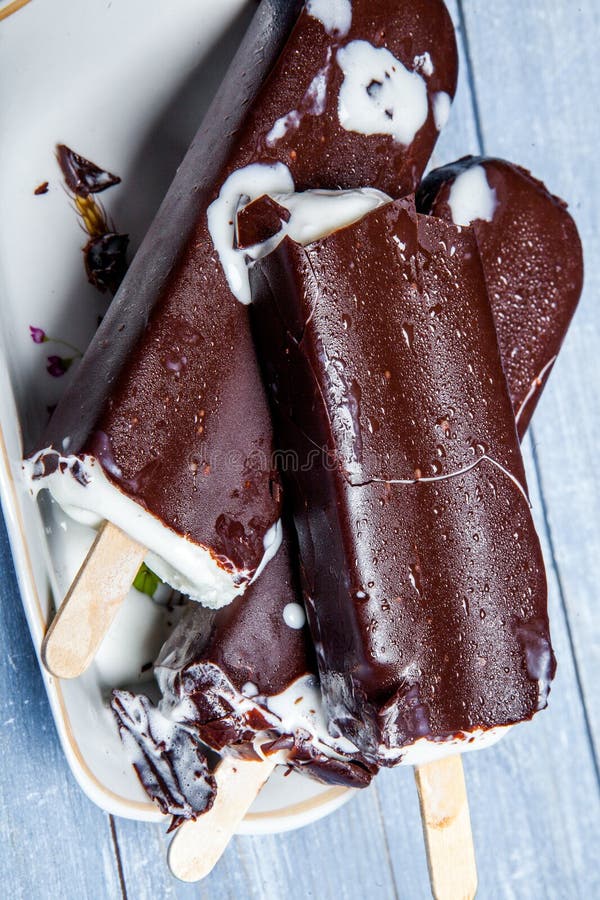 Chocolate Ice Cream Pops on a Blue Wooden Background. Chocolate Ice ...