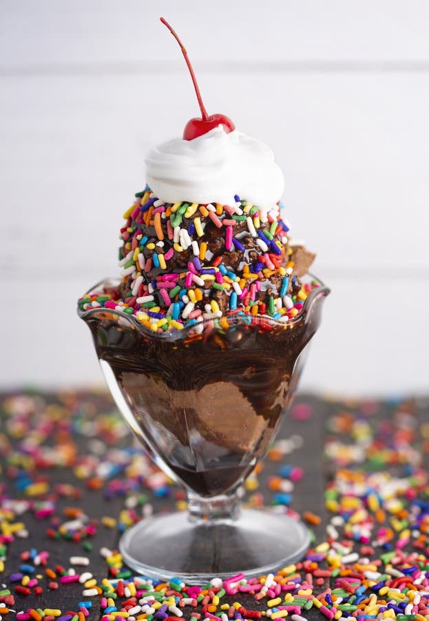 Chocolate Ice Cream Sundae With Chocolate Syrup And Rainbow Sprinkles