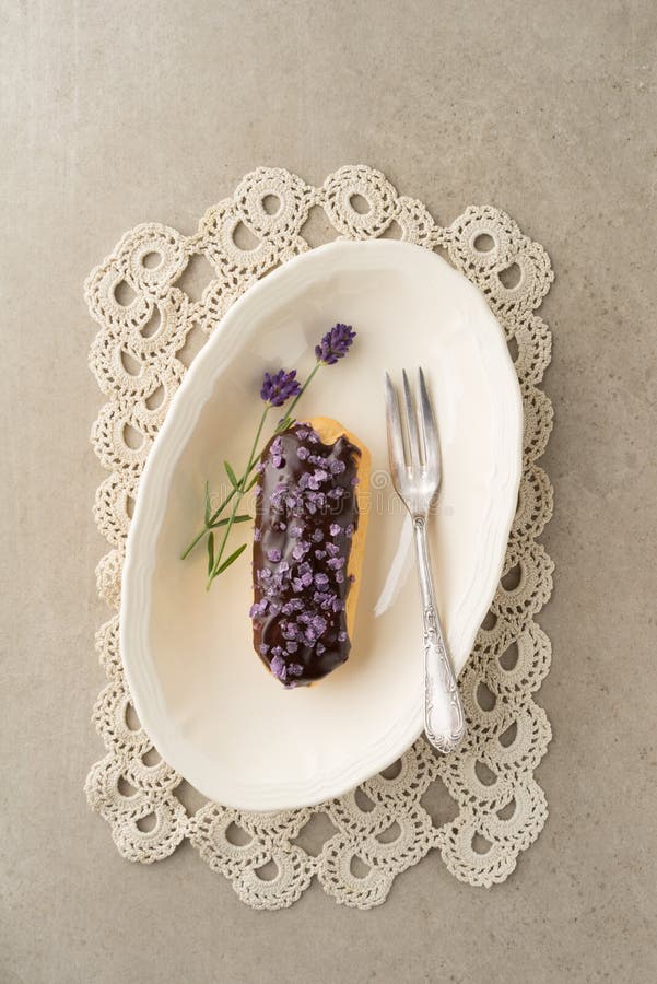 Chocolate lavender eclair stock image. Image of sugar - 73330453