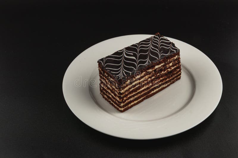 Chocolate Layered Cake on a White Plate Stock Photo - Image of layered ...