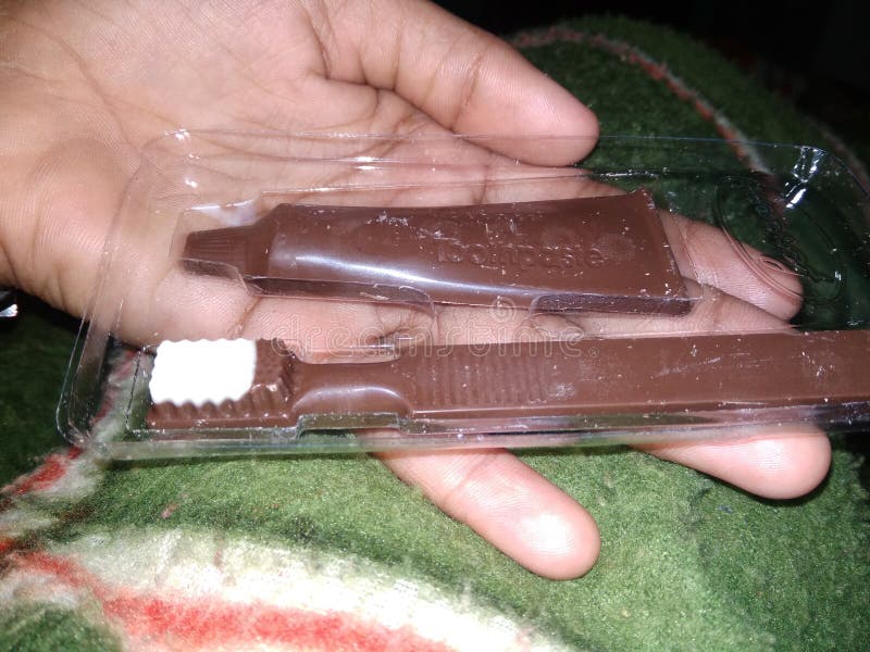 Toothbrush and Chocolate Candies Stock Photo - Image of dental, candy ...