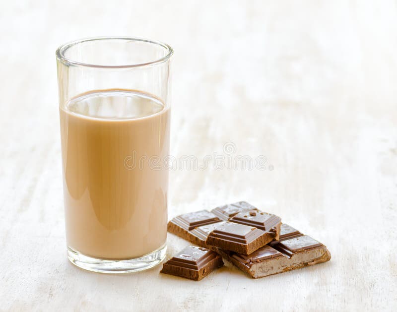 Chocolate Milk and Chocolate on White Wooden Table Stock Photo - Image ...