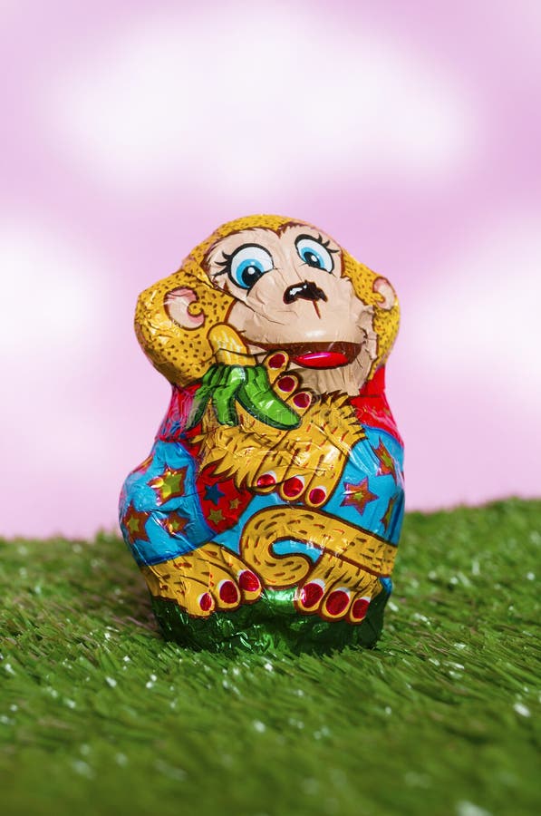 Chocolate Monkey in a Wrapper Stock Photo - Image of celebrate, blue ...